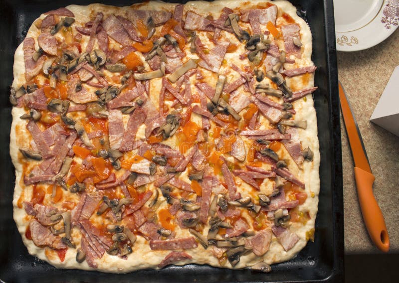 Cooking pizza at home stock image. Image of ingredient - 74086619