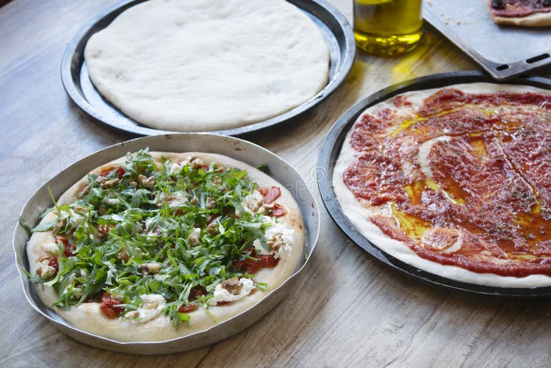 Cooking pizza at home stock photo. Image of assorted - 189206218