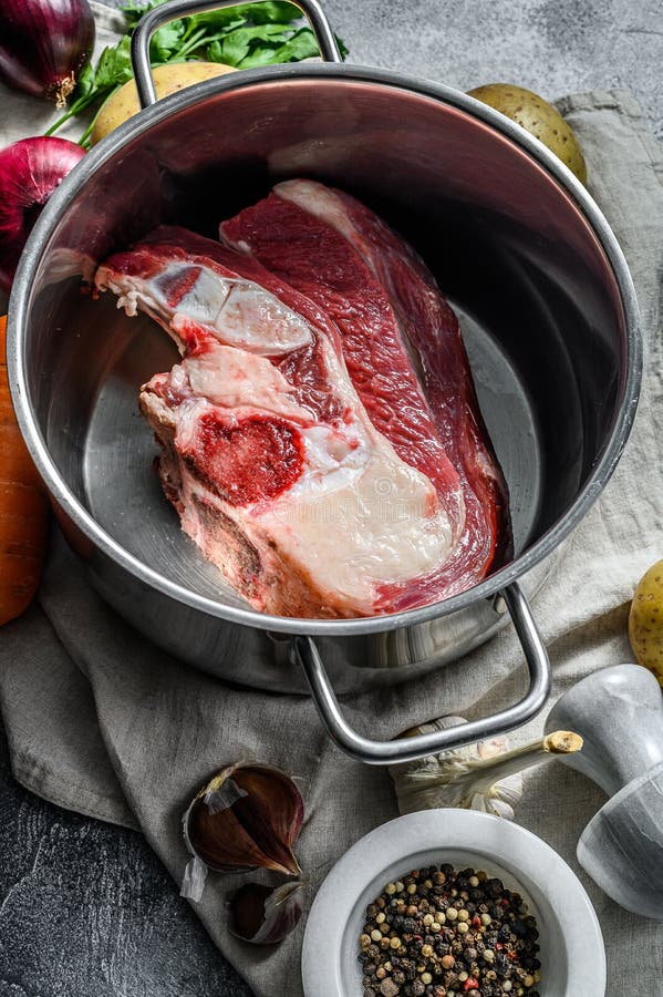 Cooking Pot with Bone Broth Meat. Vegetables Cooking Ingredients and ...