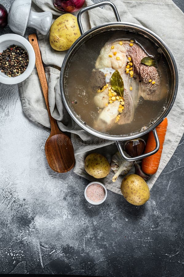 Cooking Pot with Bone Broth Meat. Vegetables Cooking Ingredients and ...