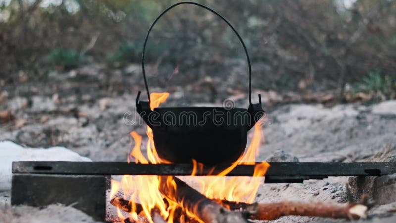 Cooking Pot on Campfire stock video. Video of camping - 336433551
