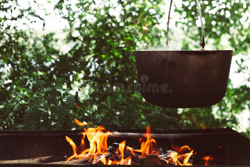 Cooking in a Pot on the Fire Stock Image - Image of fire, camp: 130993355