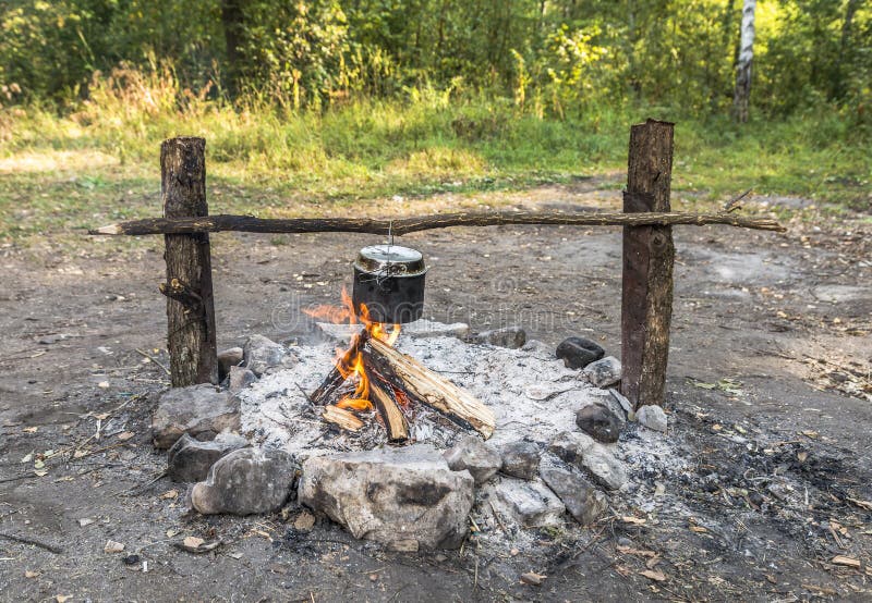 Cooking in a Pot Over the Fire. Stock Photo - Image of holiday, light ...