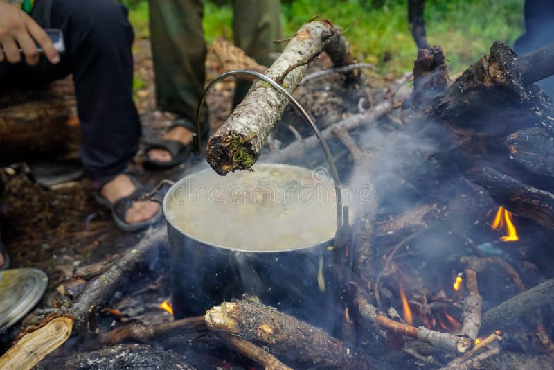 Cooking in a Pot Over a Fire in the Taiga Stock Photo - Image of burn ...