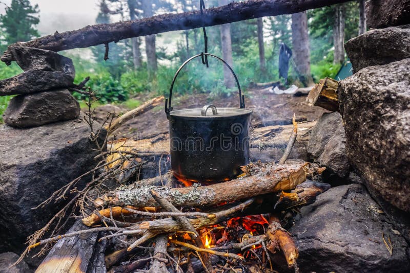 Cooking in a Pot Over a Fire in the Taiga Stock Photo - Image of ...