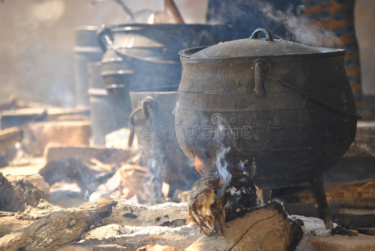 Cooking pots on a fire stock photo. Image of campfire - 59965374