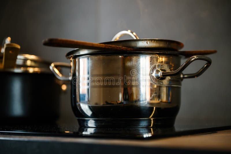Cooking Pots on Induction Cooktop in the Kitchen, Food Preparation ...