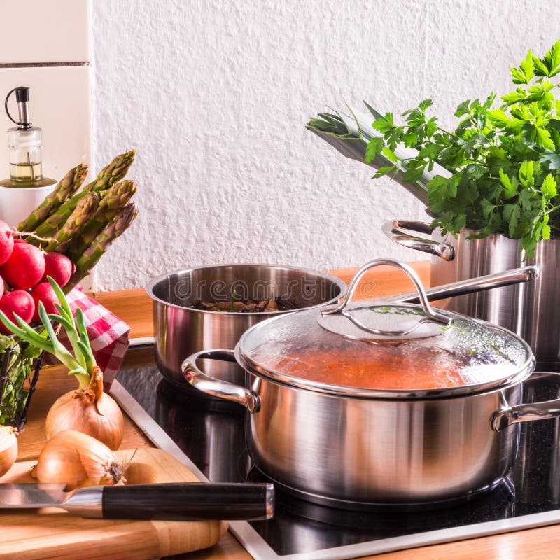 Cooking pots on the stove stock image. Image of cooking - 70620083