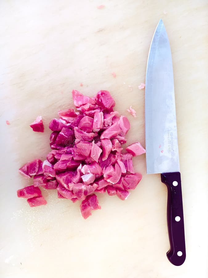 Cooking Preparation by Cutting the Beef into Cubes Stock Photo - Image ...