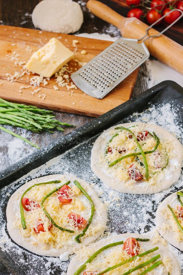 Cooking Process of Making Mini Pizza - Small and Personal, with Cheese ...