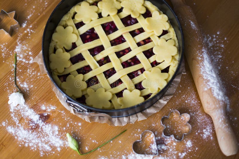Cooking Process: Raw Homemade Pie with a Mesh of Dough and Red Berries ...