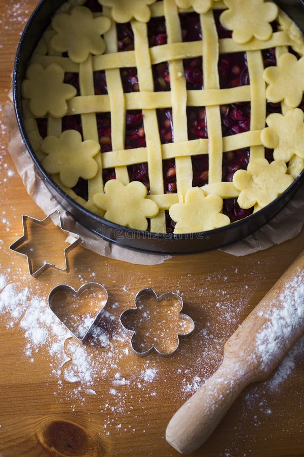 Cooking Process: Raw Homemade Pie with a Mesh of Dough and Red Berries ...