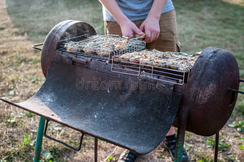 Cooking Raw Meat in a Grid on the Barbeque Grill Stock Photo - Image of ...