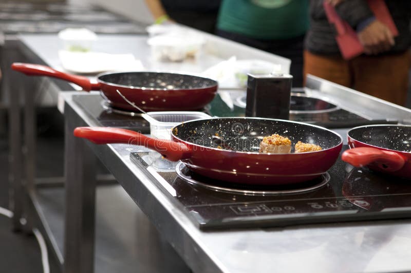 Cooking on red pan stock image. Image of cuisine, indoors - 53483941