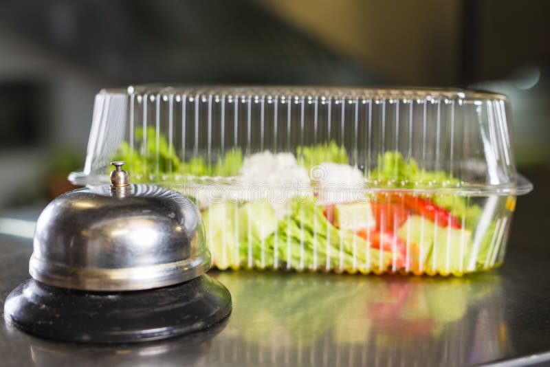 Cooking in a Restaurant and Packing in a Container for Delivery Stock ...