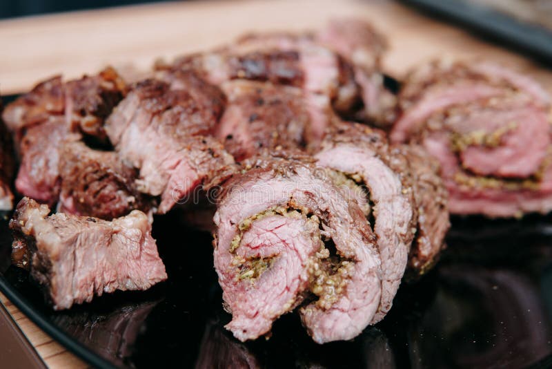 Cooking Ribeye Steaks and Meat Rolls in the Cooking Class. Sliced Meat ...
