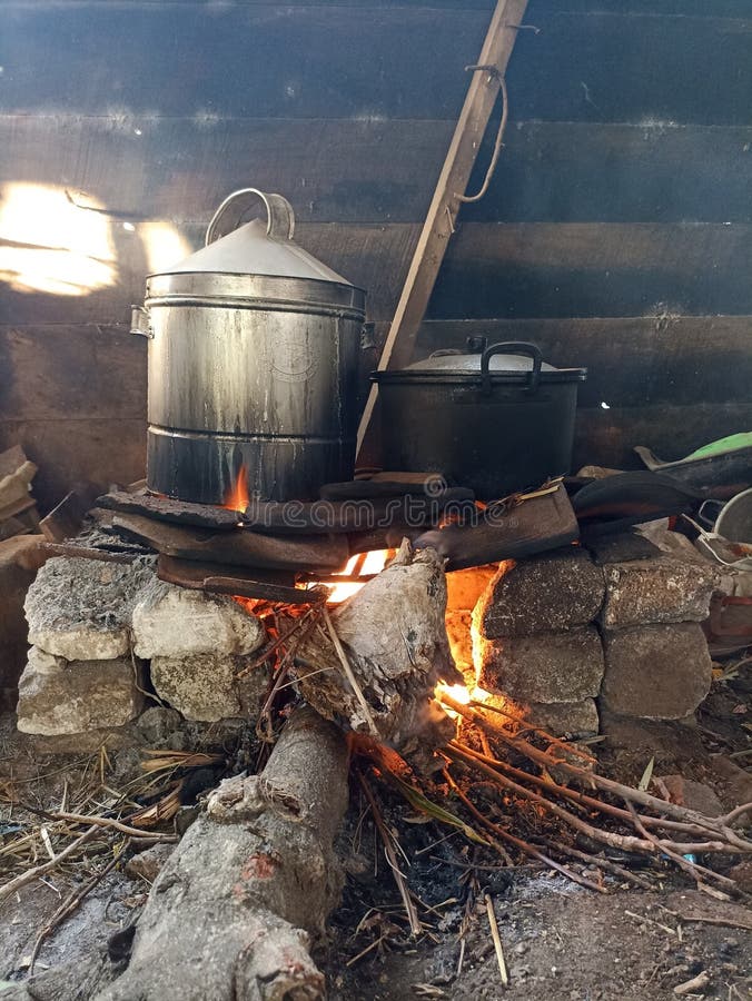 Cooking Rice and Boiling Water Using a Traditional Stove Stock Image ...