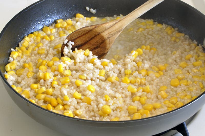 Cooking rice and corn stock photo. Image of dish, cooking - 26842738