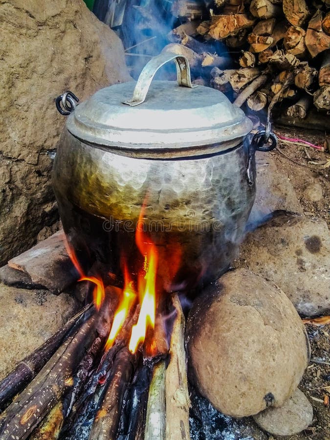 Cooking Rice Using Firewood Stock Photo - Image of cooking, iron: 374889230