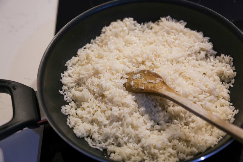 Cooking Rice by Wooden Spoon Stock Image - Image of vegetable, seafood ...