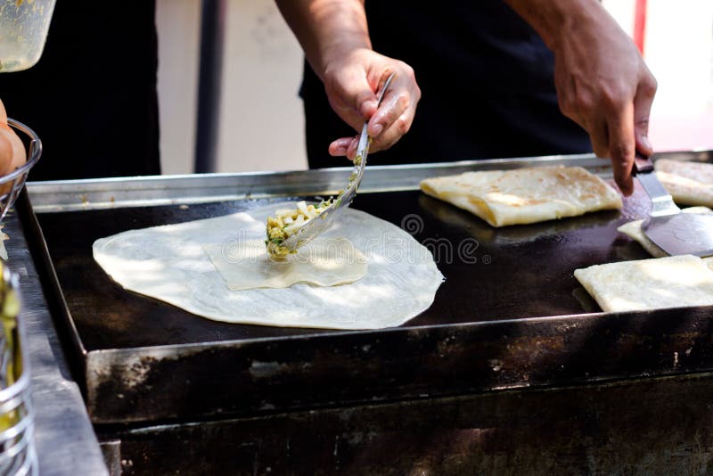 Cooking Roti on pan stock photo. Image of indian, food - 129726024