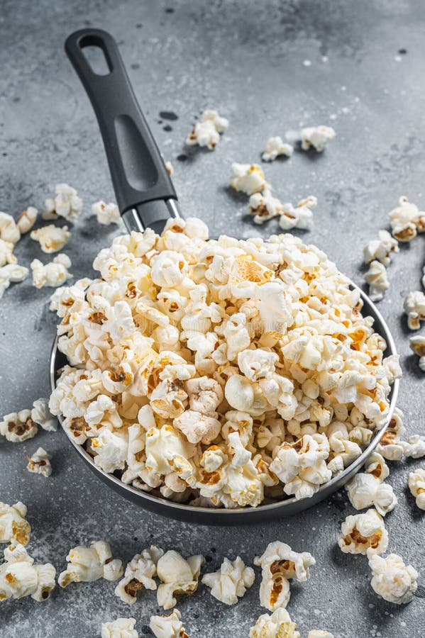 Cooking Salted Popcorn in a Skillet. Gray Background Stock Photo ...