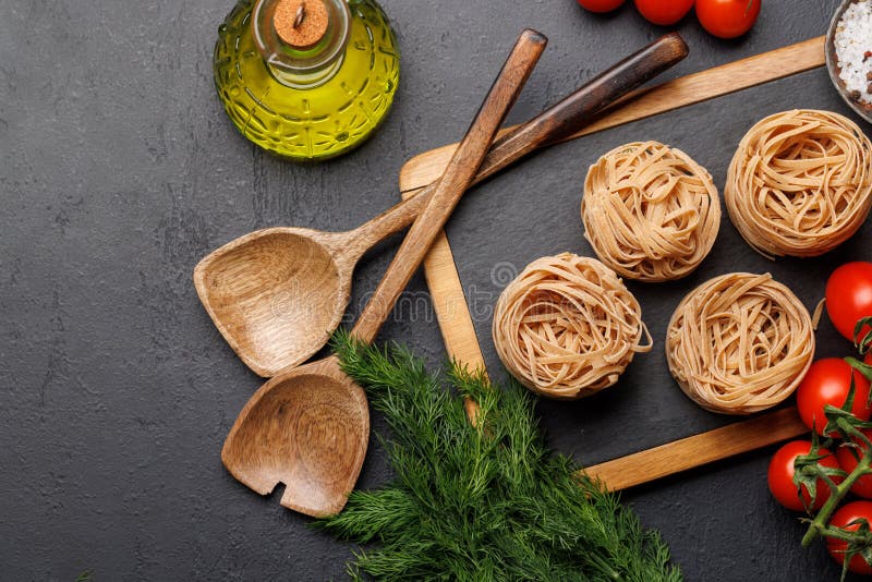 Cooking Scene: Cherry Tomatoes, Pasta, Spices on Table Stock Image ...