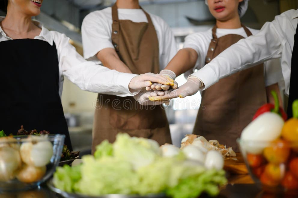 Cooking School Students Celebrating Teamwork in Kitchen Stock Image ...