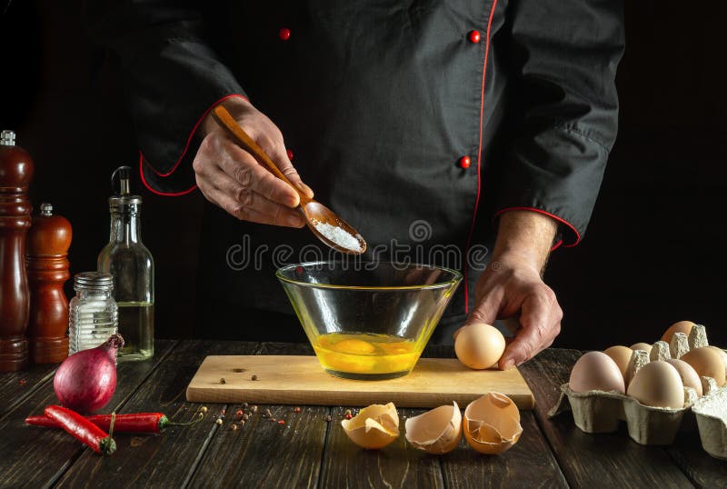 Cooking Scrambled Eggs for Breakfast by the Hands of the Chef in the ...