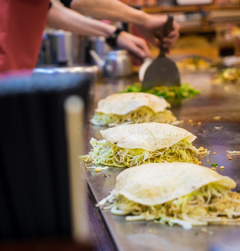 Cooking a Set of Japanese Pizza on Hot Counter Stock Photo - Image of ...