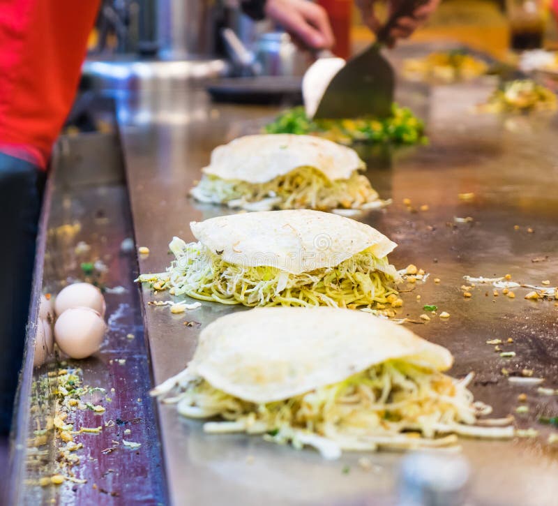 Cooking a Set of Japanese Pizza on Hot Counter Stock Photo - Image of ...