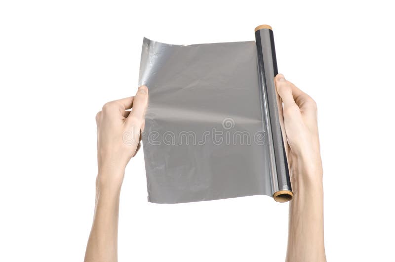 Cooking and Shisha Topic: Human Hand Holding a Foil Isolated on White ...