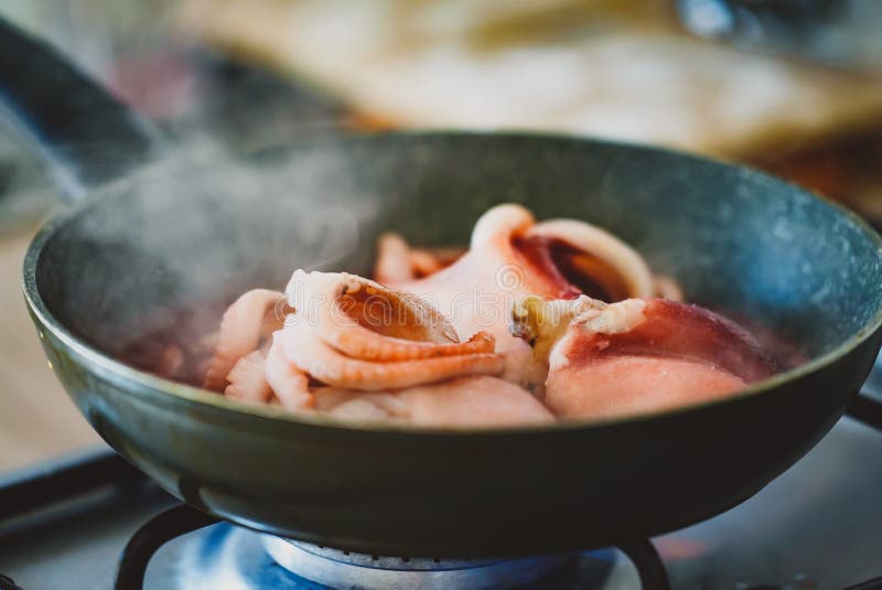 Cooking small octopuses stock image. Image of asian - 267234629