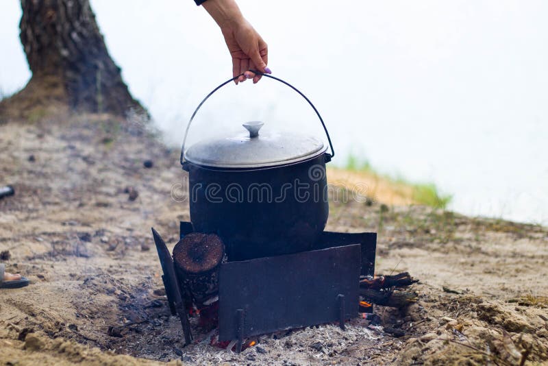 Cooking Soup in a Pot on the Fire Stock Image - Image of meal, hand ...