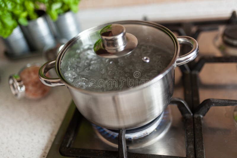 Cooking spaghetti in a pot stock photo. Image of black - 120846462