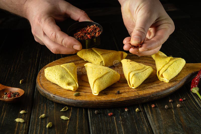 Cooking Spring Rolls with the Hands of a Chef on a Kitchen Board ...