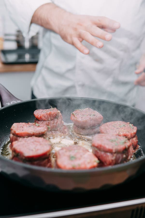 Cooking Steaks in a Frying Pan. Cooking Beef in a Cooking Master Class ...