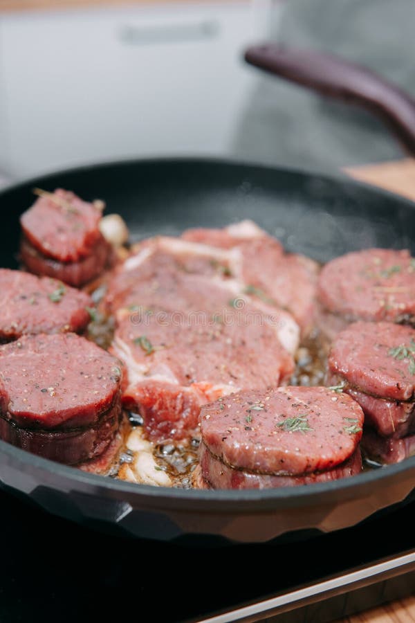Cooking Steaks in a Frying Pan. Cooking Beef in a Cooking Master Class ...