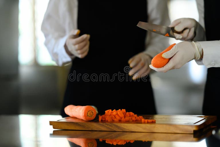 Cooking Students Slicing Vegetables during a Cooking Class Stock Photo ...