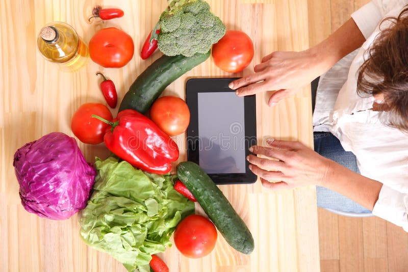 Cooking with a Tablet PC stock image. Image of caucasian - 76802915