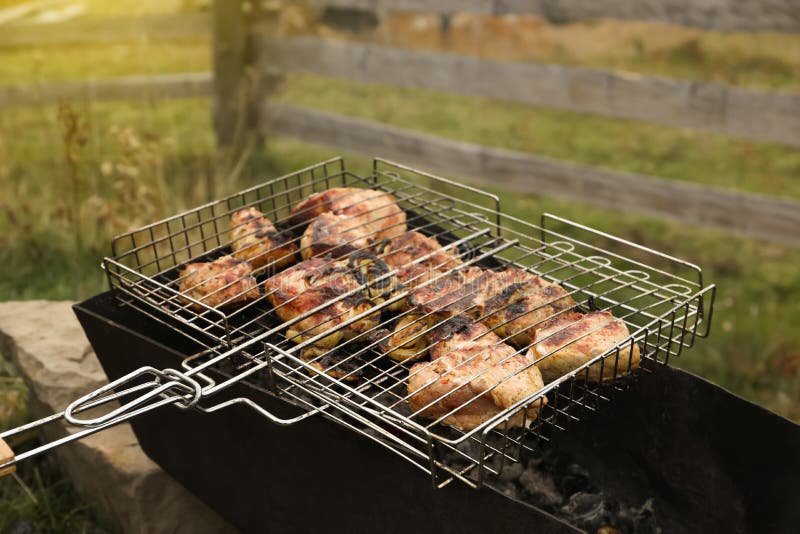 Cooking Tasty Meat on Barbecue Grill Outdoors Stock Photo - Image of ...