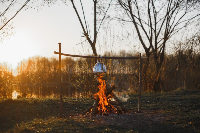 Cooking Tea on a Fire in a Kettle at Sunset Stock Image - Image of ...