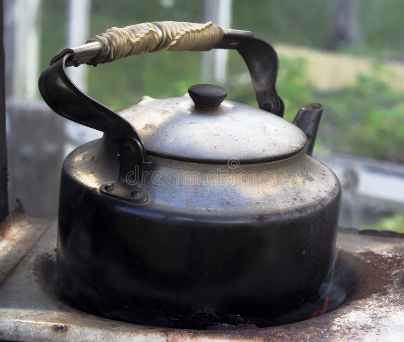 Cooking Tea in the Open Air, on a Live Fire Stock Photo - Image of ...