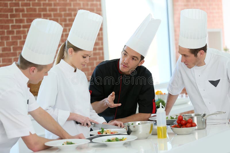 Cooking Team in the Kitchen Stock Image - Image of toque, food: 51285401