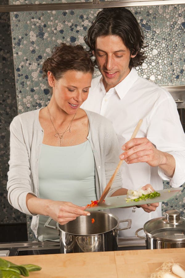 Woman Cooking Man with House Model Stock Image - Image of happiness ...