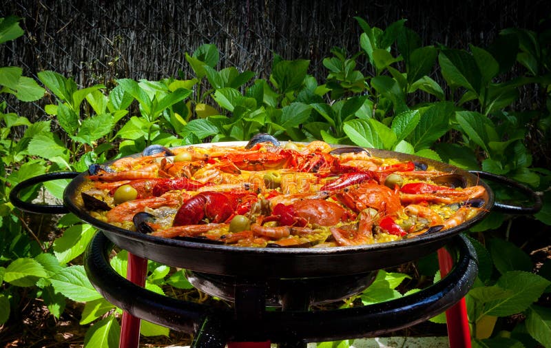 Cooking Traditional Paella stock image. Image of mediterranean - 32577967