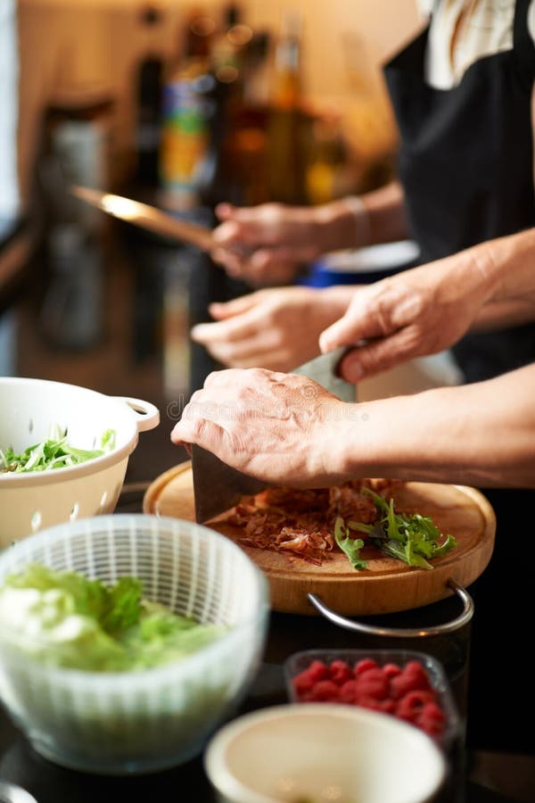 Cooking Up a Storm. a Couple Cooking in the Kitchen. Stock Image ...