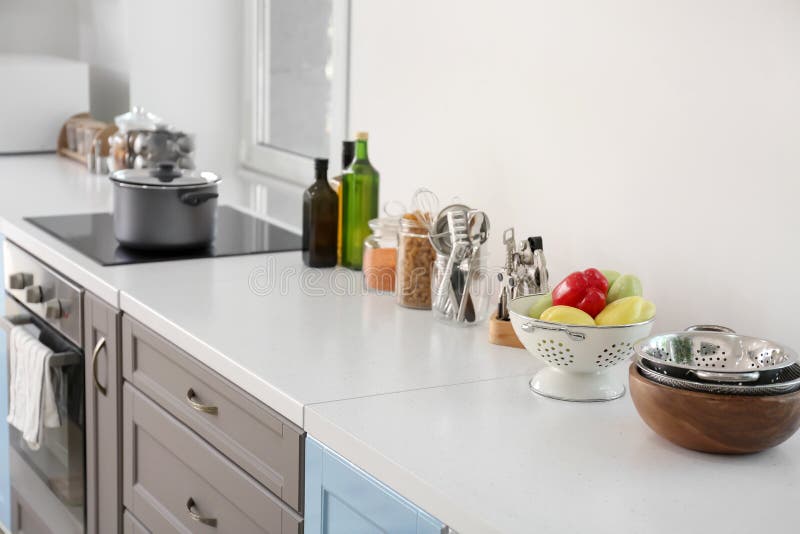 Cooking Utensils with Fresh Vegetables and Dishes on Table in Modern ...