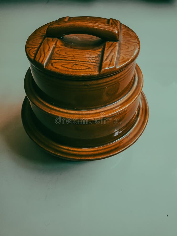 Two Stacks of Clay Pots with Colored Wooden Textures. Stock Image ...
