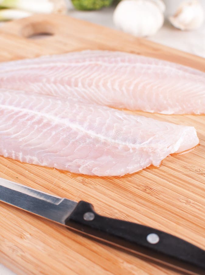 Two Raw White Fish Fillet and Knife Stock Photo - Image of hake ...